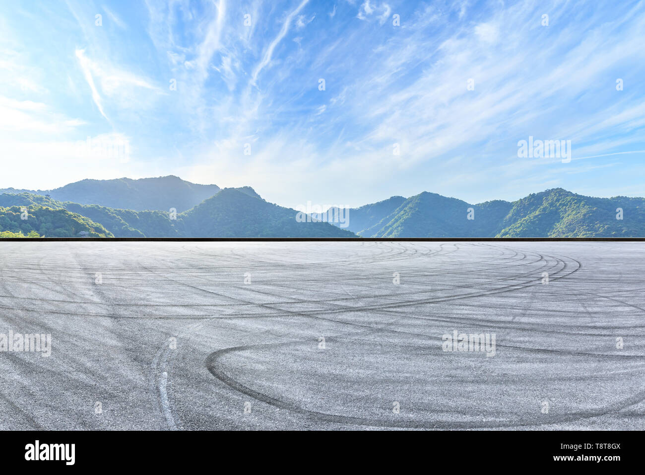 Asphalt race track ground and green mountains natural landscape Stock ...