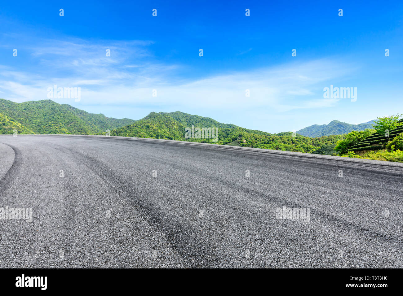 Asphalt race track ground and green mountains natural landscape Stock ...