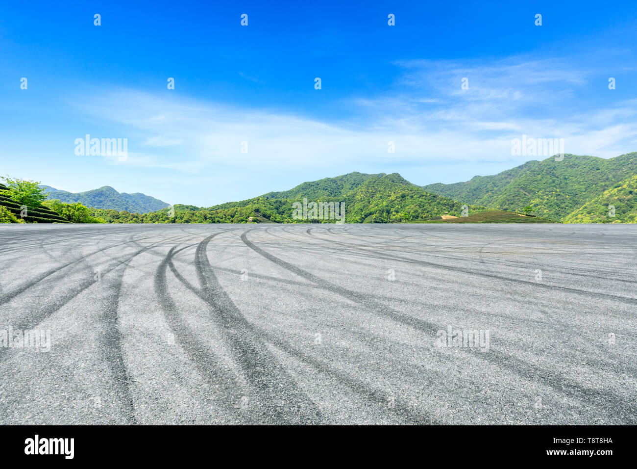 Asphalt race track ground and green mountains natural landscape Stock ...