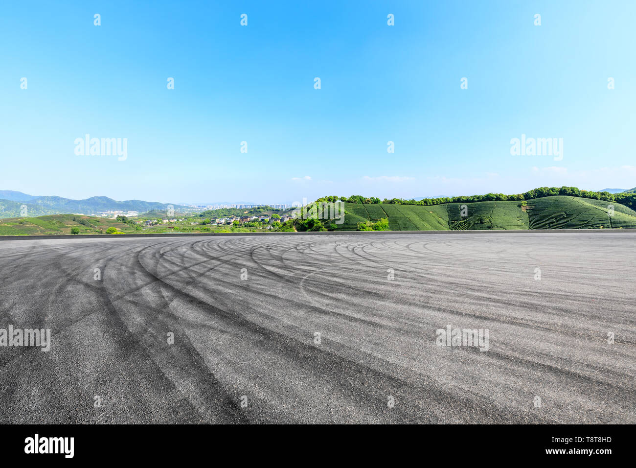 Asphalt race track ground and green mountains natural landscape Stock ...
