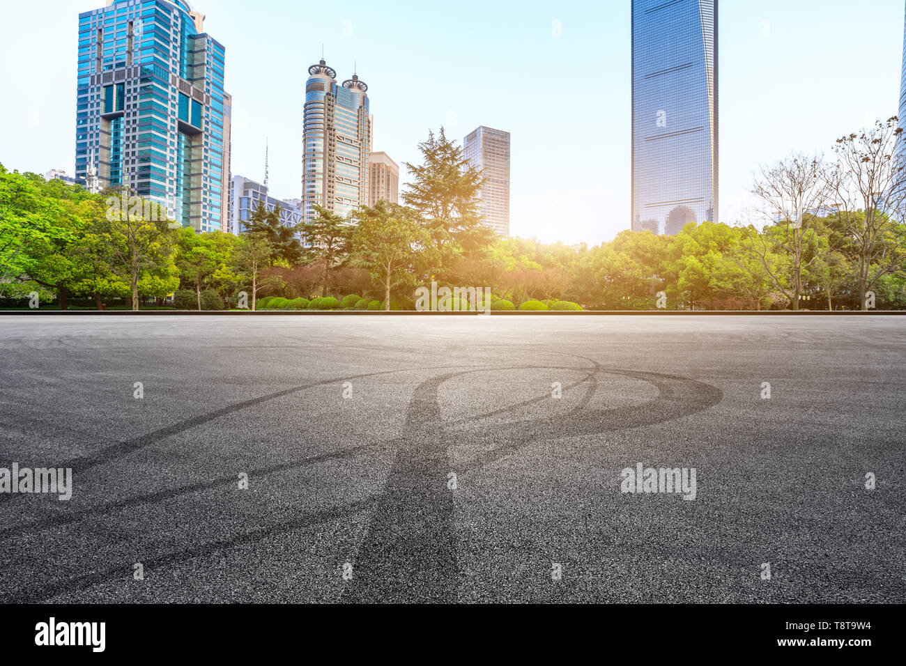 Asphalt race track and modern commercial office building in Shanghai ...