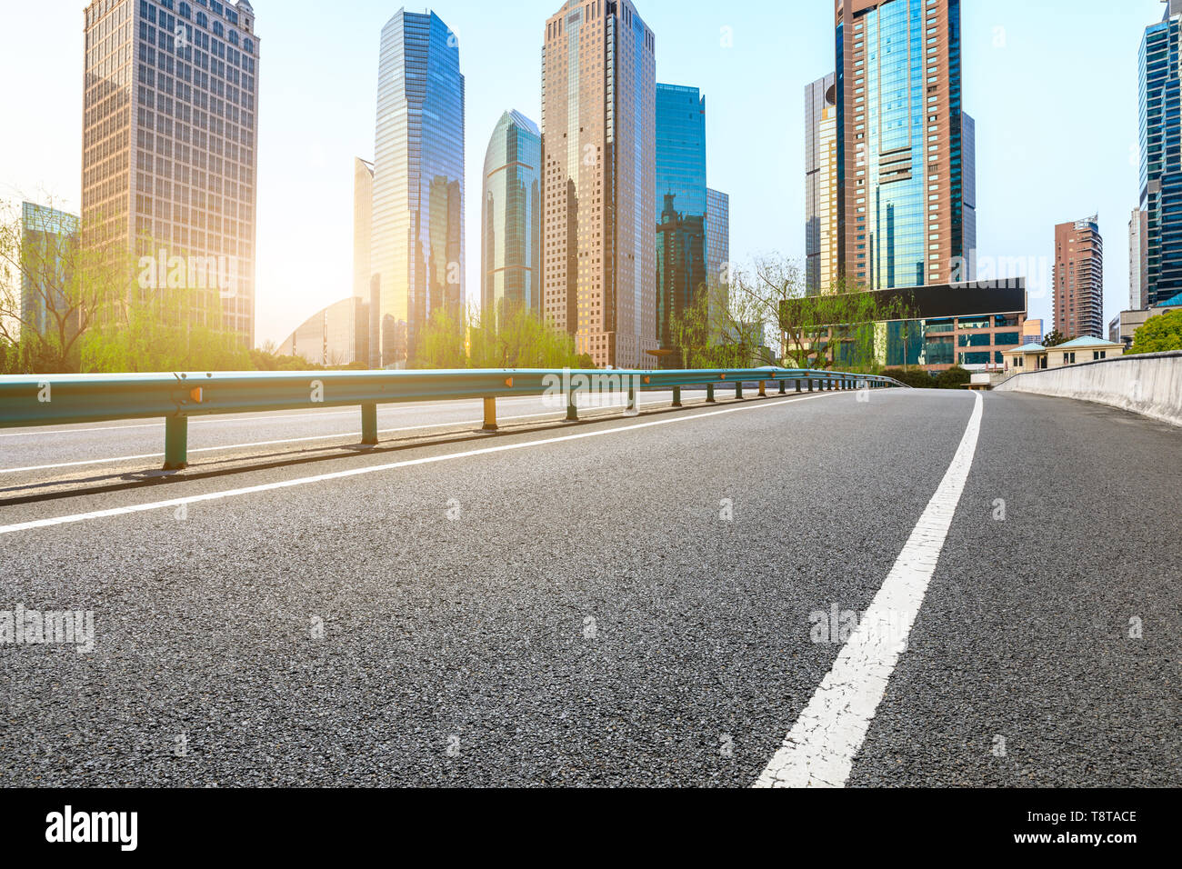 Shanghai modern commercial office buildings and empty asphalt highway ...