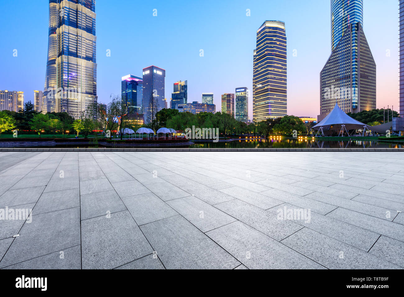 Shanghai modern commercial office buildings and square floor at night ...
