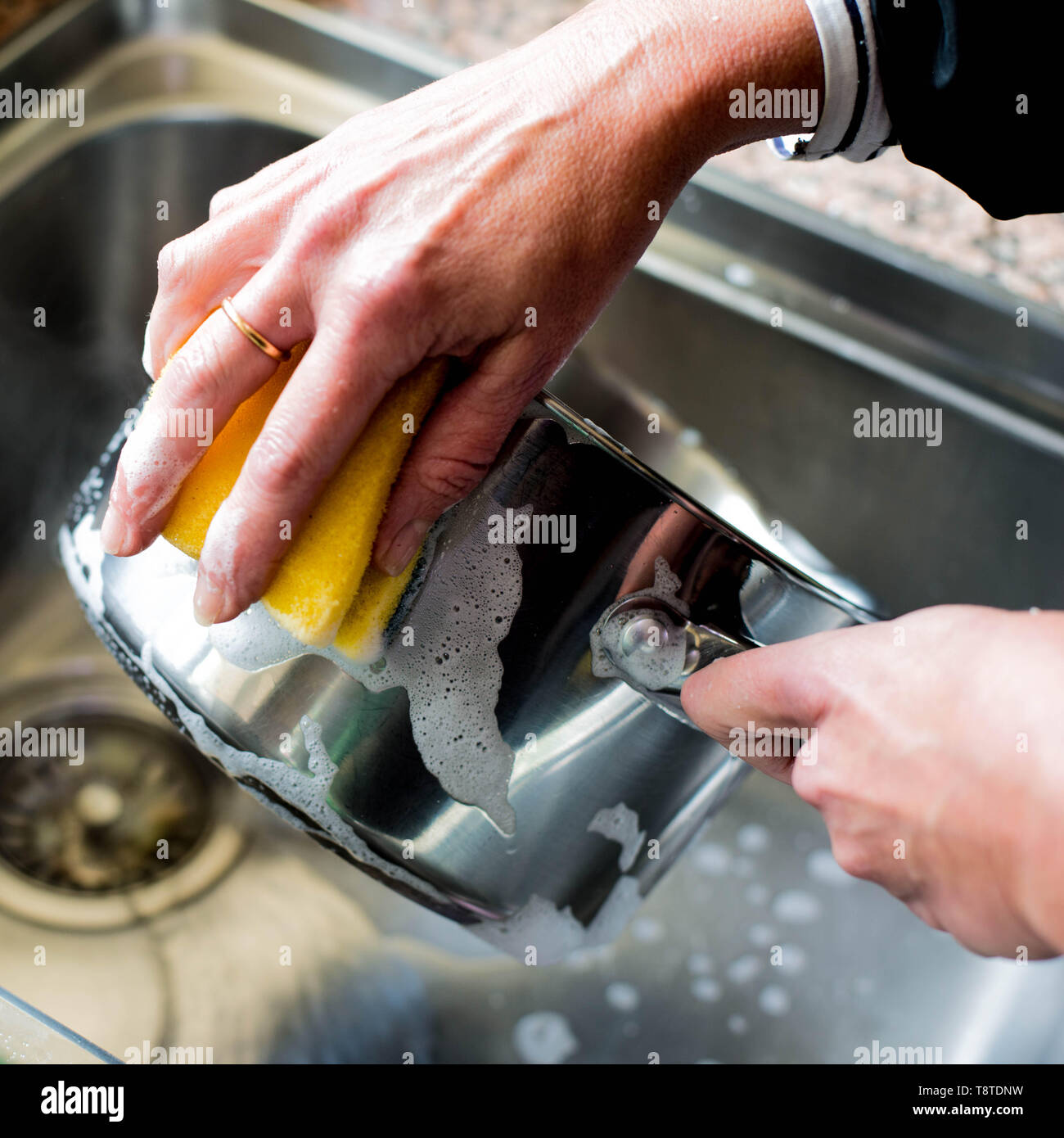 Woman washing dishes after dinner hi-res stock photography and images ...