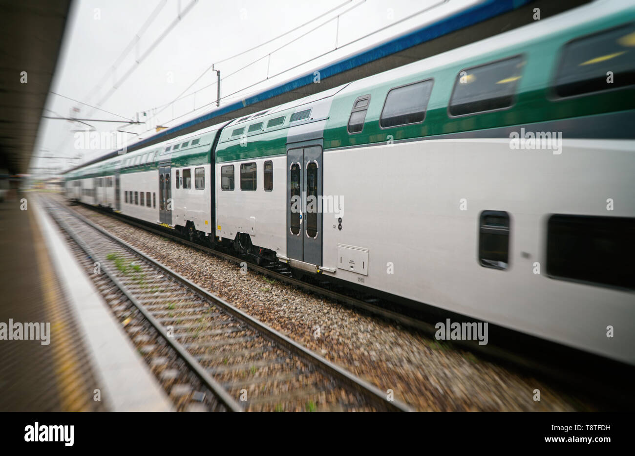 Double-decker train at the railway station in Italy Stock Photo - Alamy