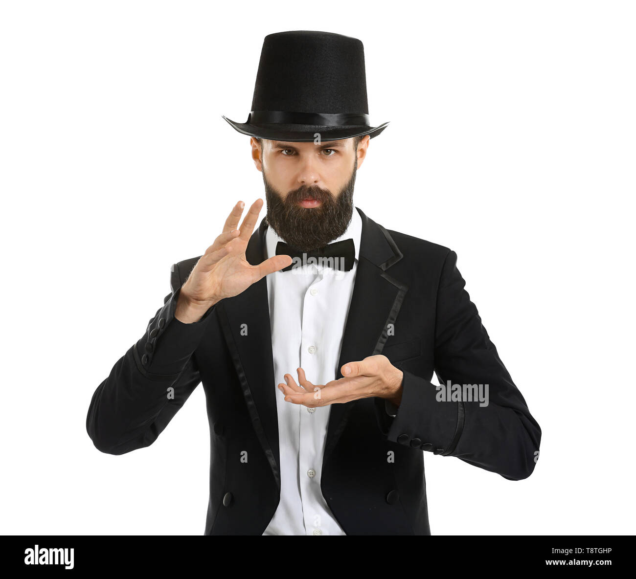Male magician on white background Stock Photo - Alamy