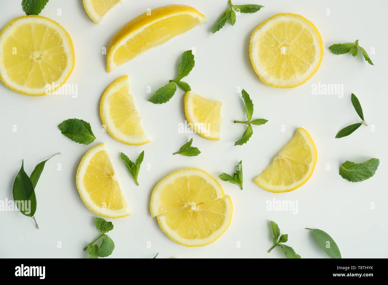Flat lay composition with lemon slices on white background Stock Photo ...