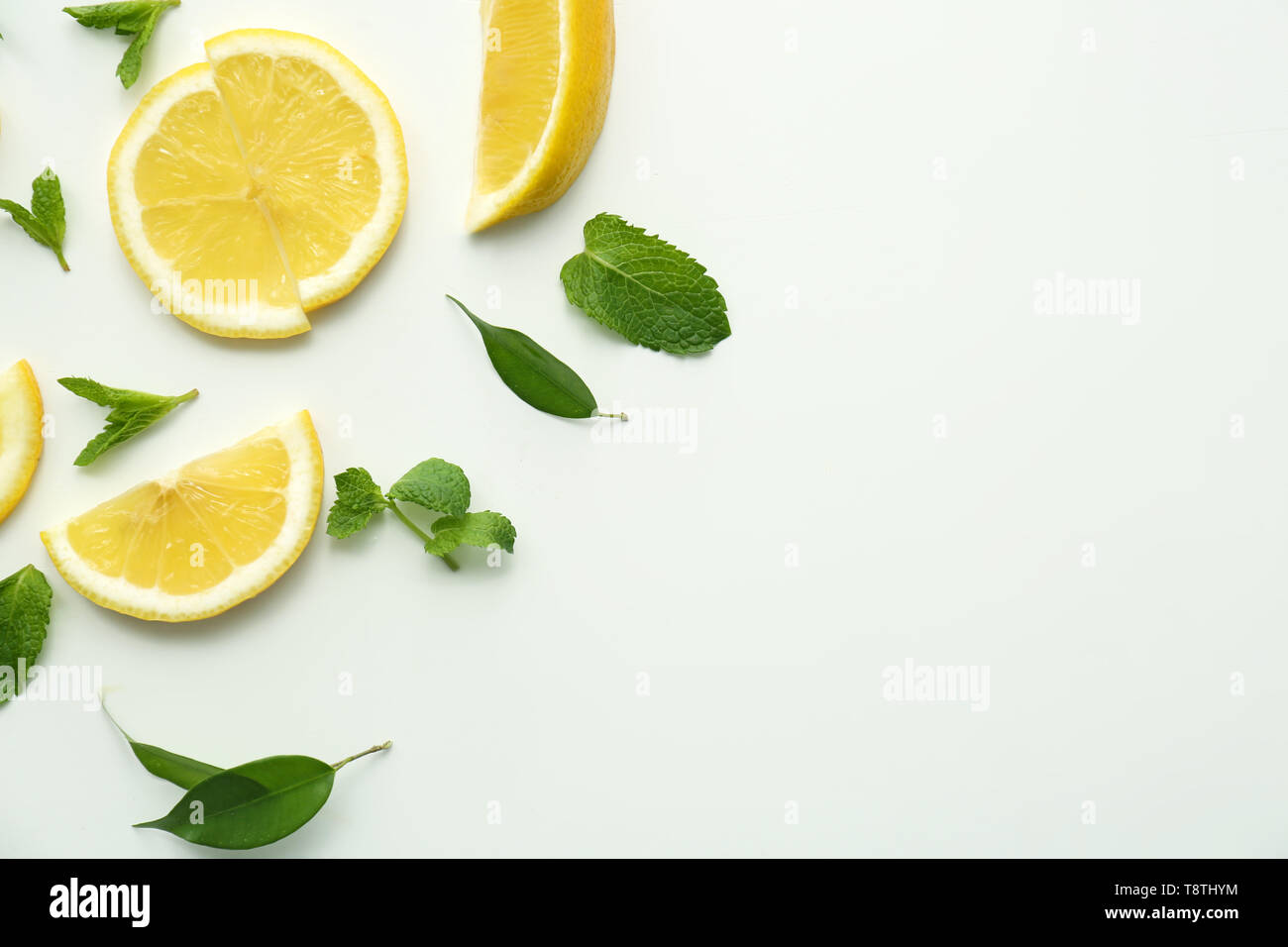 Flat lay composition with lemon slices on white background Stock Photo ...