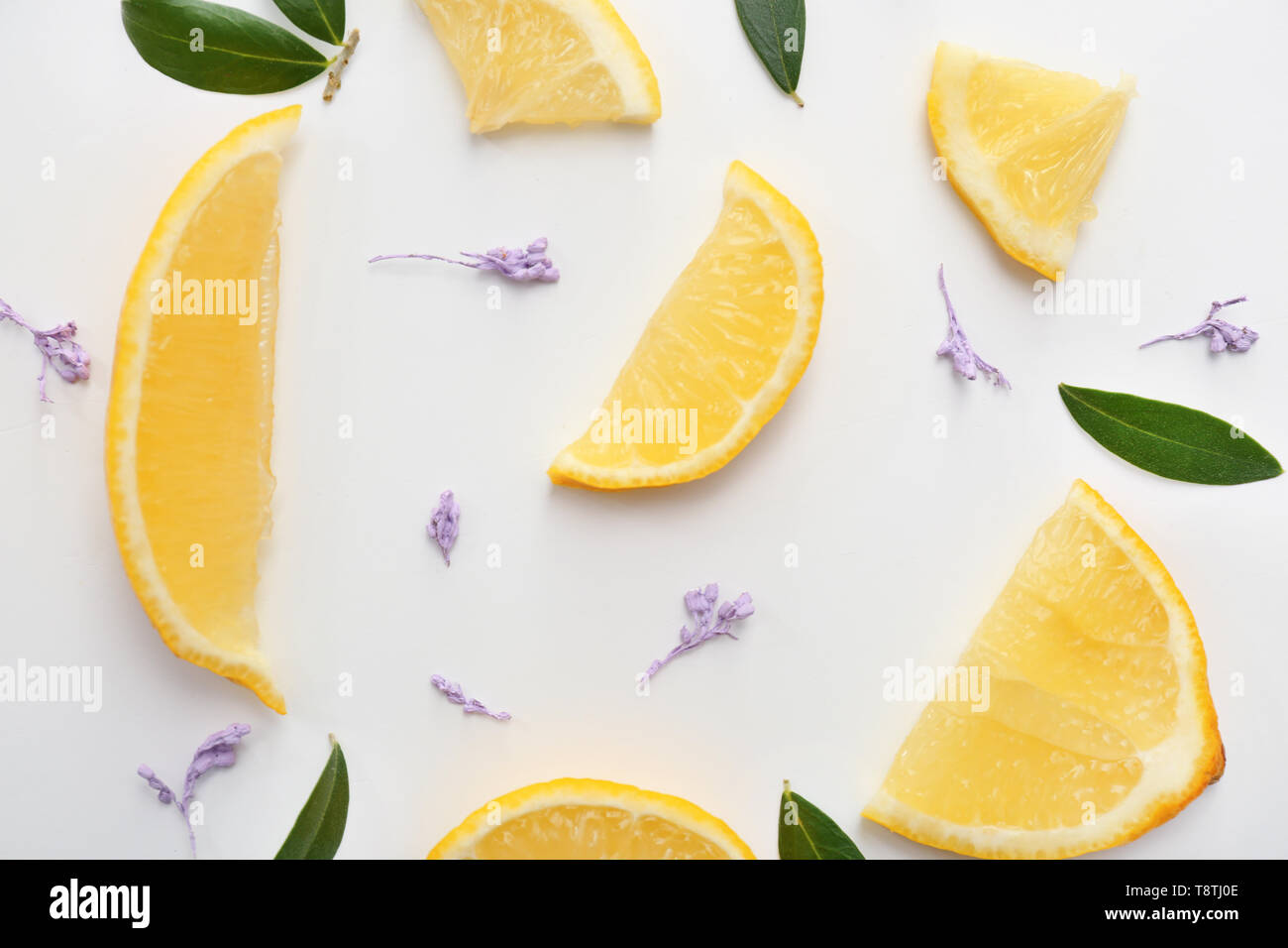 Flat lay composition with lemon slices on white background Stock Photo ...