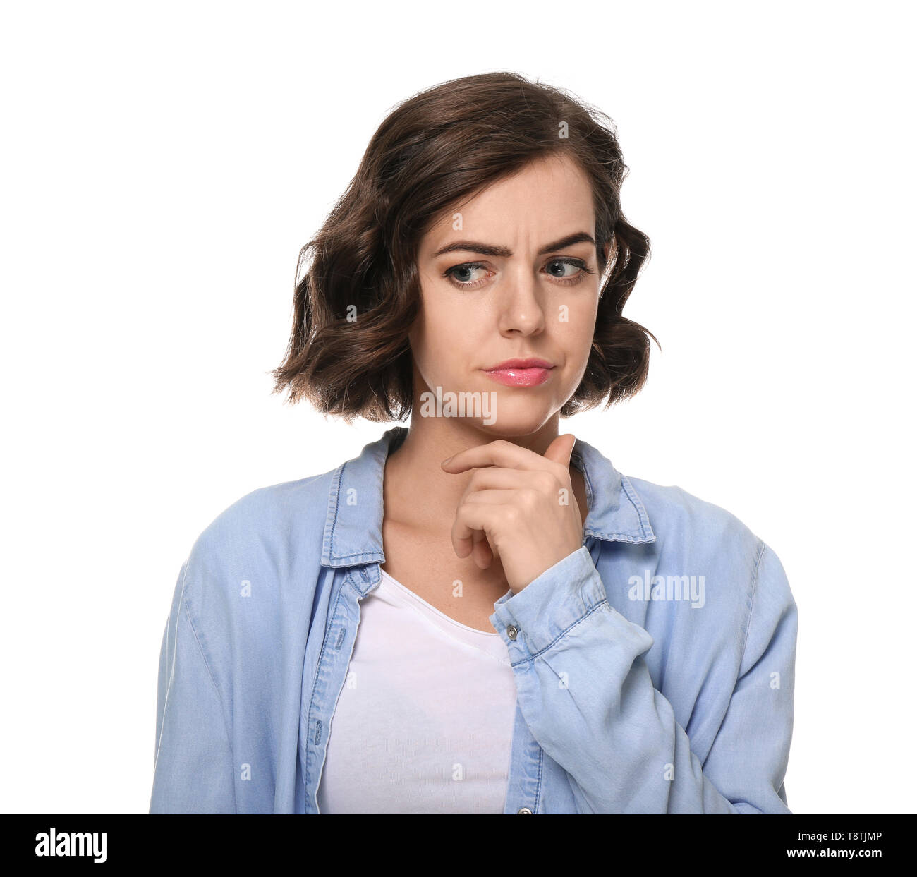 Portrait of suspicious young woman on white background Stock Photo - Alamy