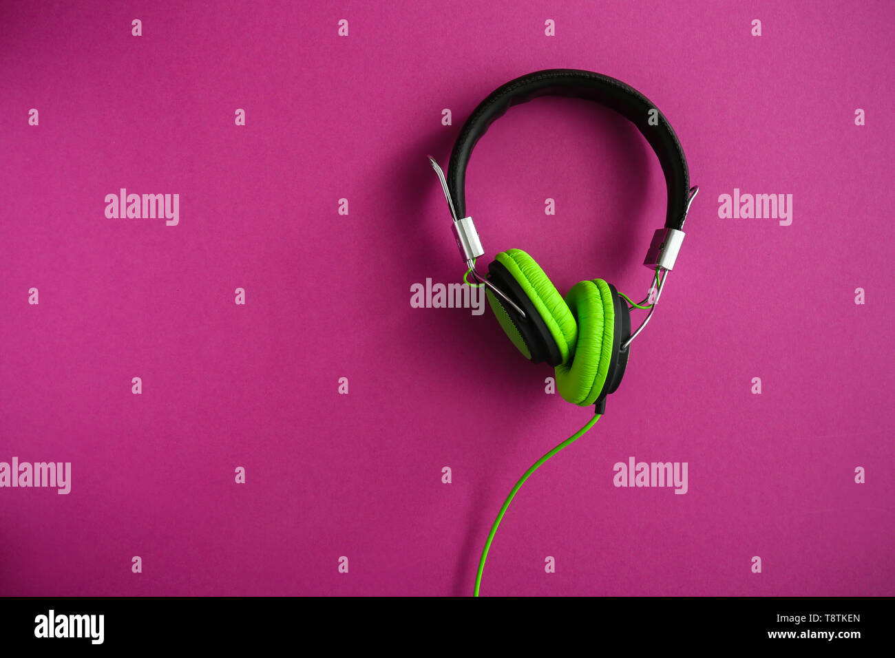 Modern headphones on color background Stock Photo - Alamy