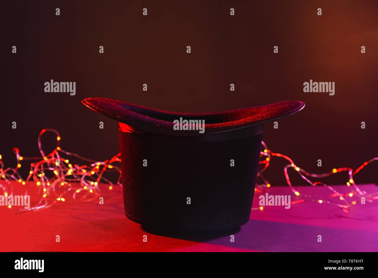 Black magician hat on dark color background Stock Photo - Alamy