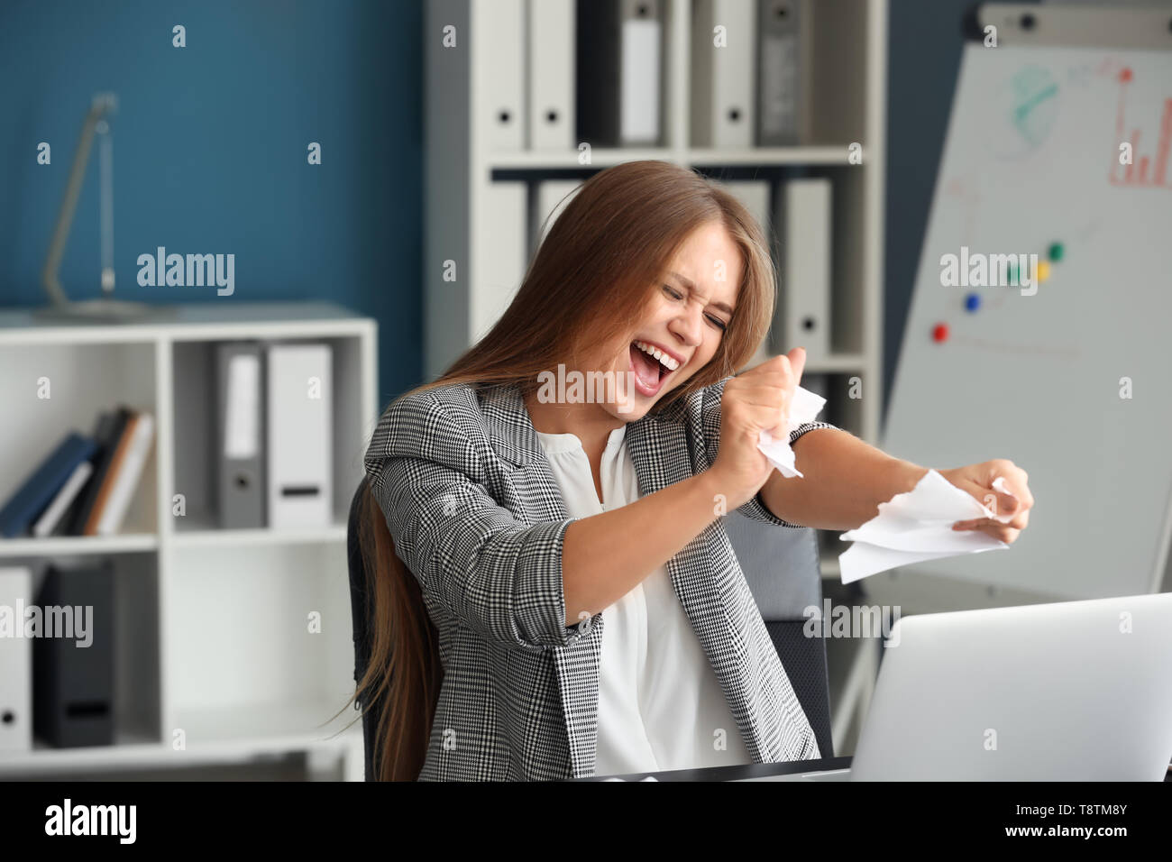 Woman tearing paper hi-res stock photography and images - Alamy