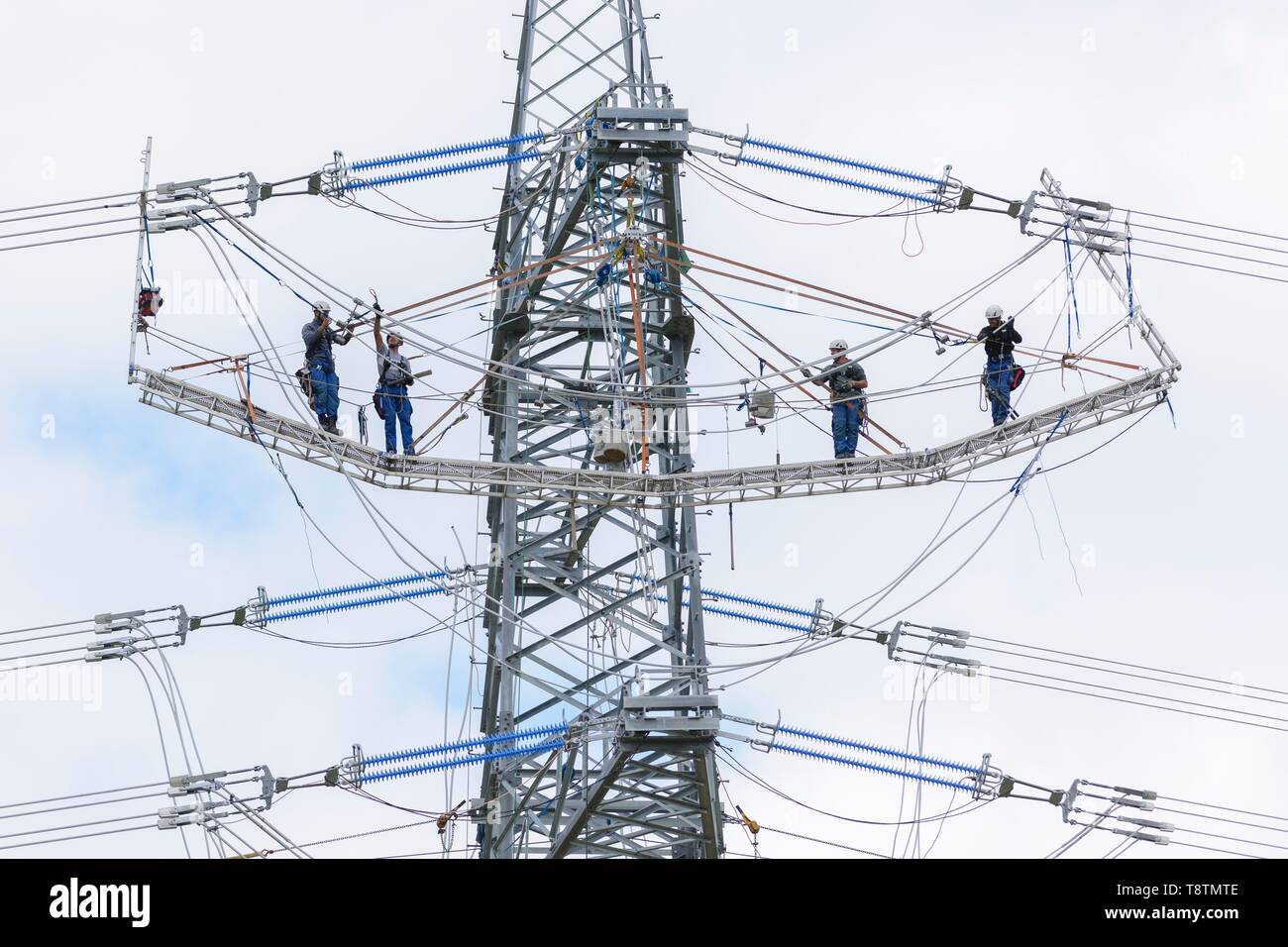 High-voltage engineers, overhead power lines, Germany Stock Photo - Alamy