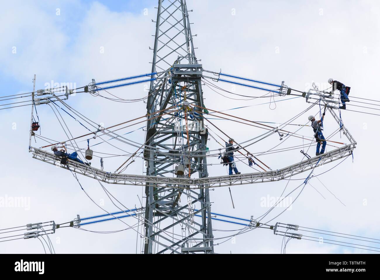 High-voltage engineers, overhead power lines, Germany Stock Photo - Alamy