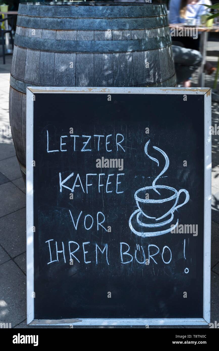 Advertising board in front of a cafe, last coffee before your office ...