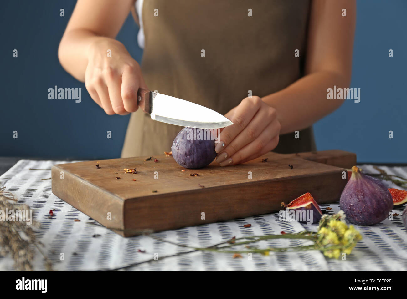 Woman cutting fresh figs hi-res stock photography and images - Alamy