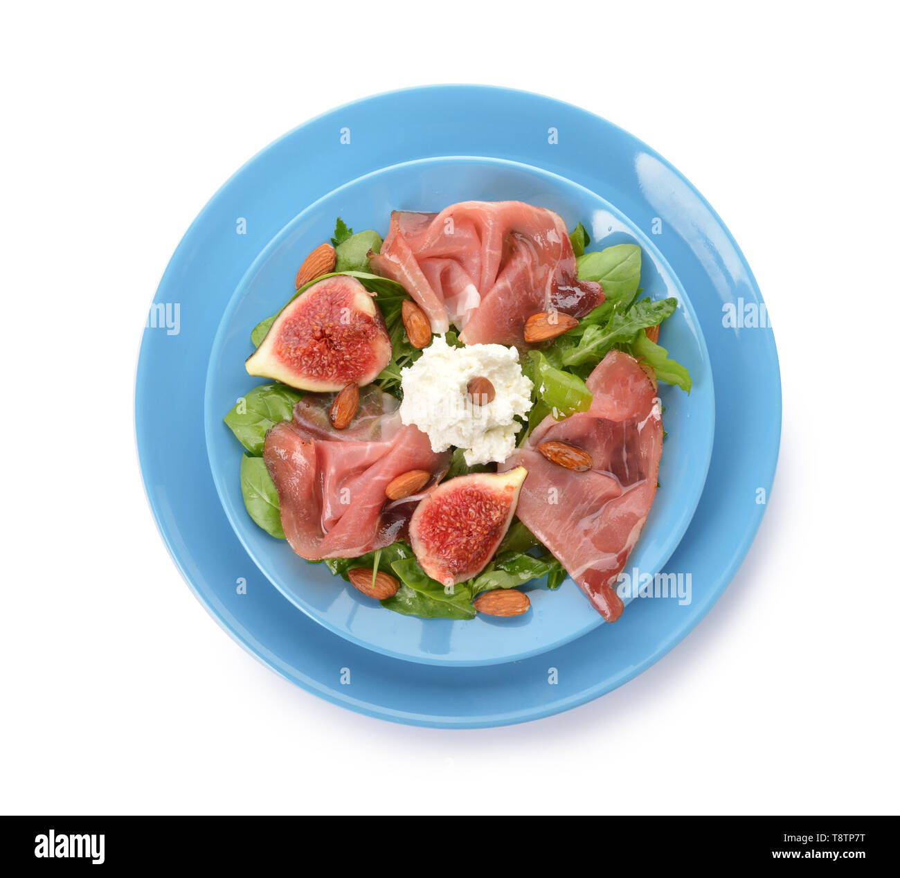 Plates with delicious fig salad on white background Stock Photo - Alamy