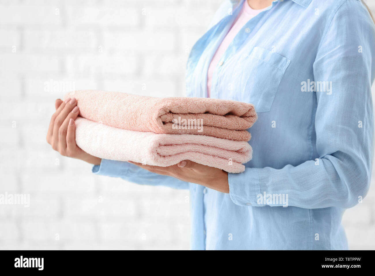 Holding dry towels hi-res stock photography and images - Alamy