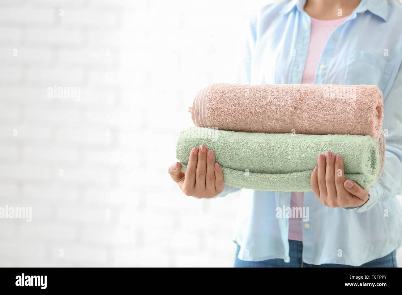 Holding dry towels hi-res stock photography and images - Alamy