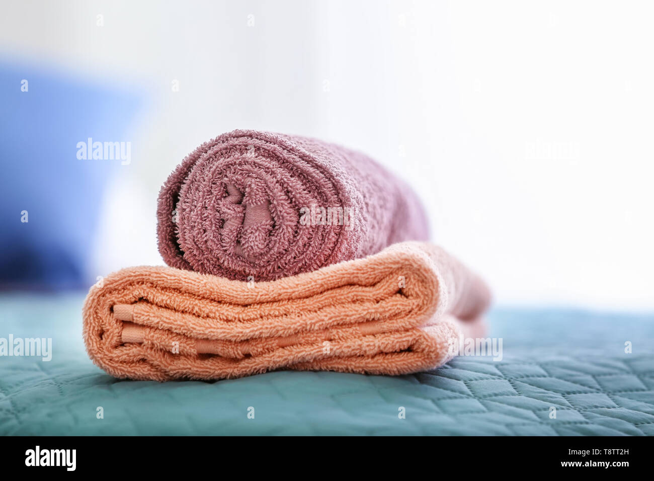 Clean soft towels on bed Stock Photo - Alamy