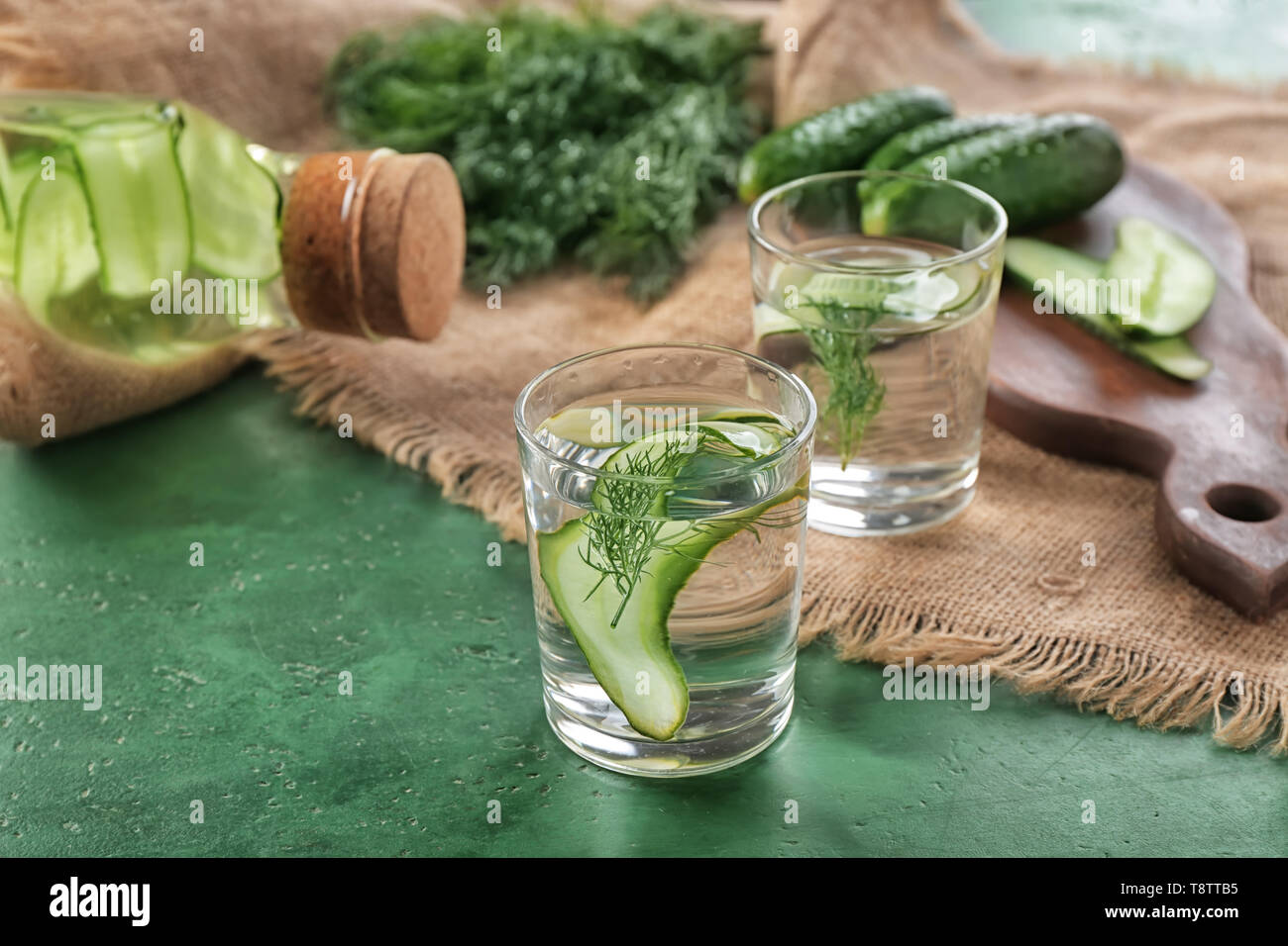Glasses of fresh cucumber water on color table Stock Photo - Alamy