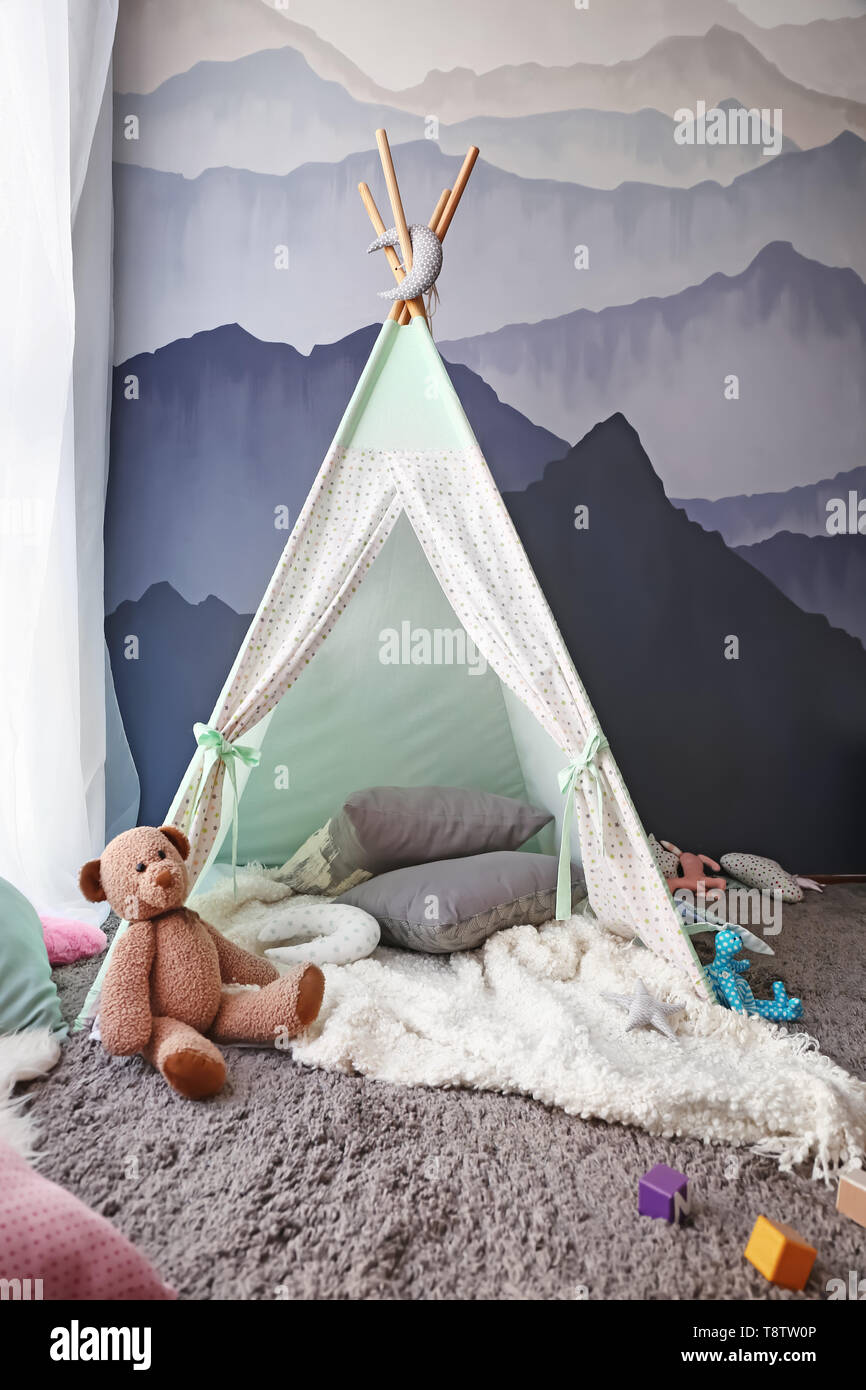 Cozy play tent for kids in child room Stock Photo - Alamy