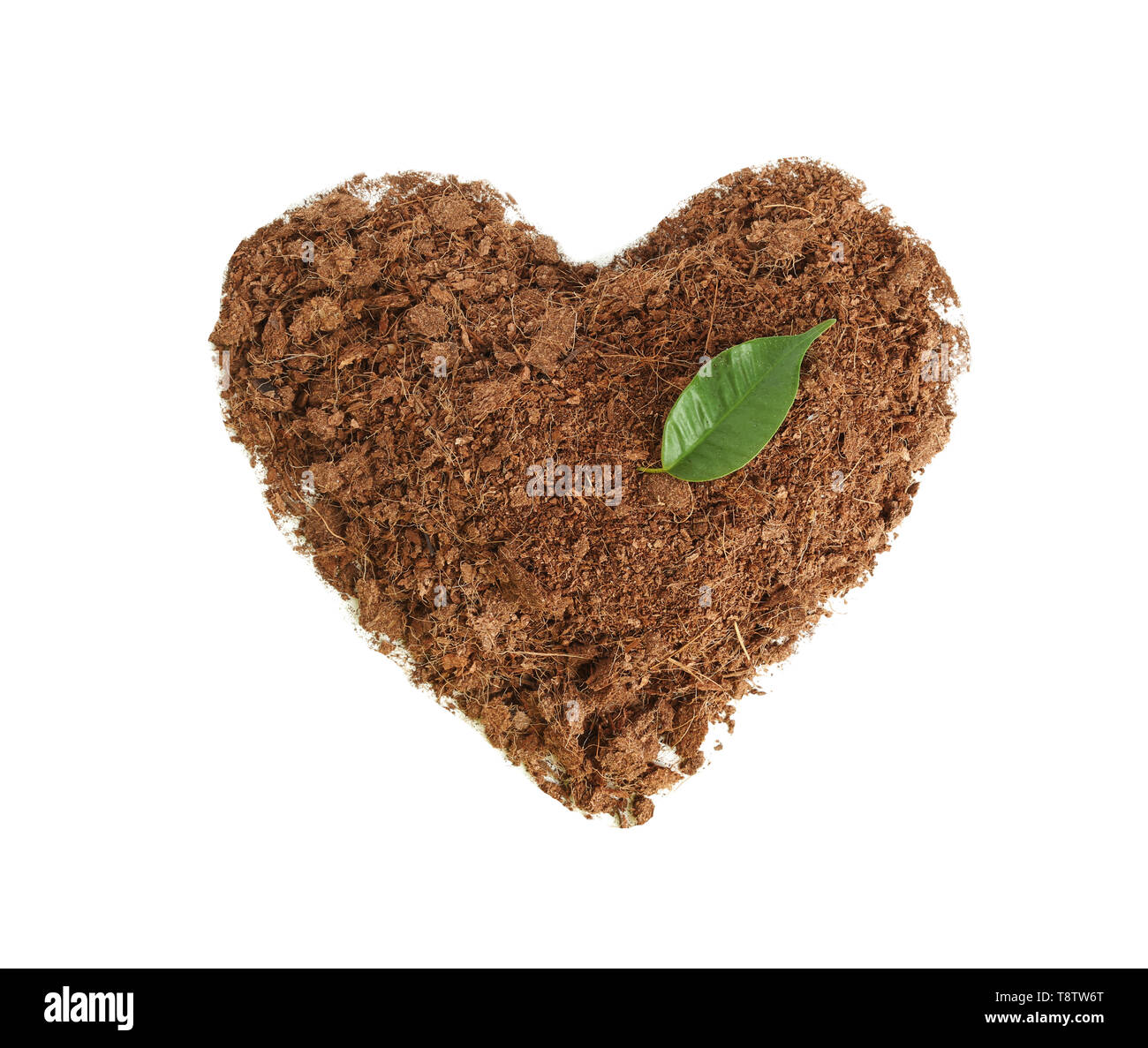 Heart made of soil on white background Stock Photo - Alamy