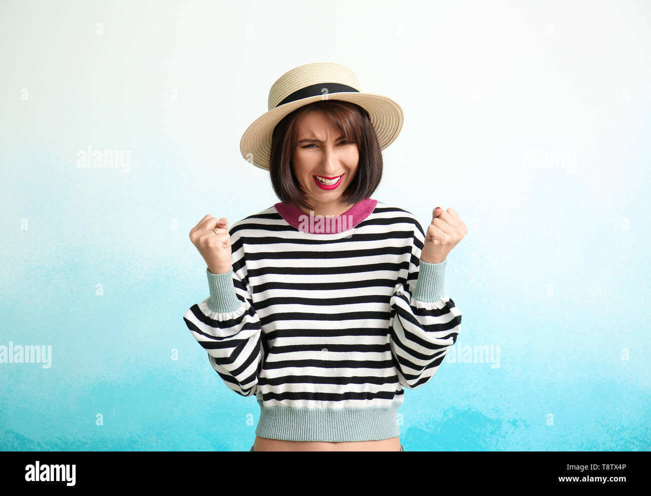 Portrait of beautiful angry woman on color background Stock Photo - Alamy