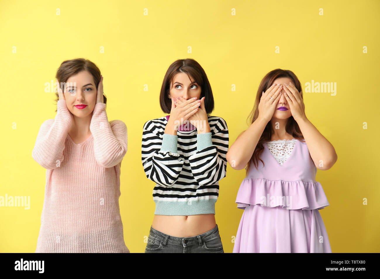 Portrait of beautiful women hearing no evil, seeing no evil and ...