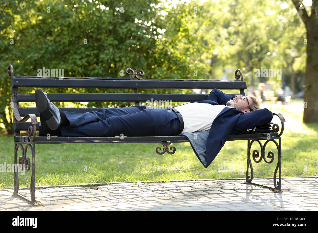 Young man lying on work bench hi-res stock photography and images - Alamy