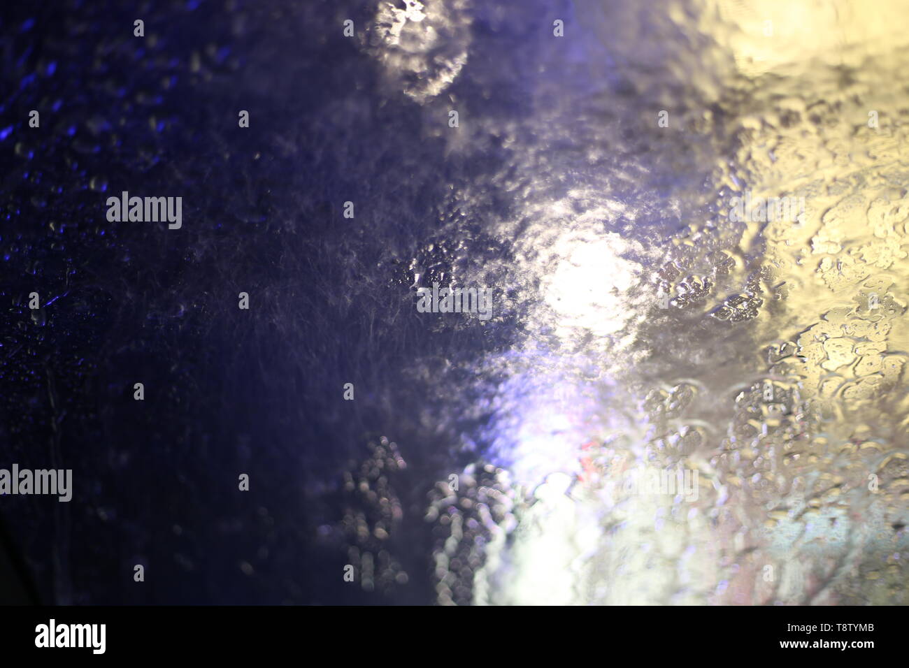 Rain through a window at night Stock Photo - Alamy