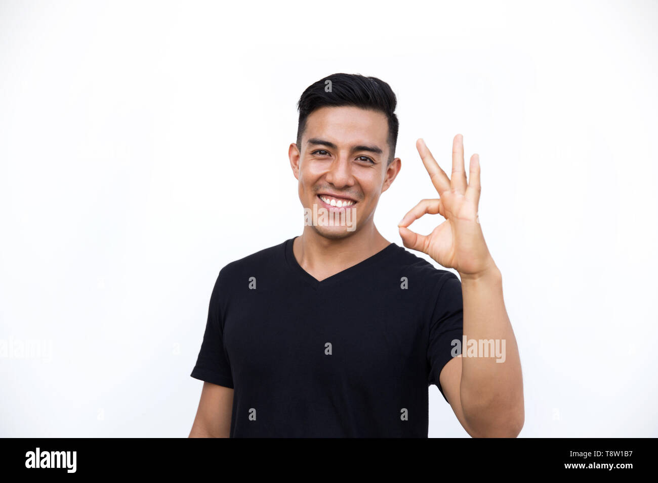 Happy excited young man making okay sign with fingers. Isolated on ...