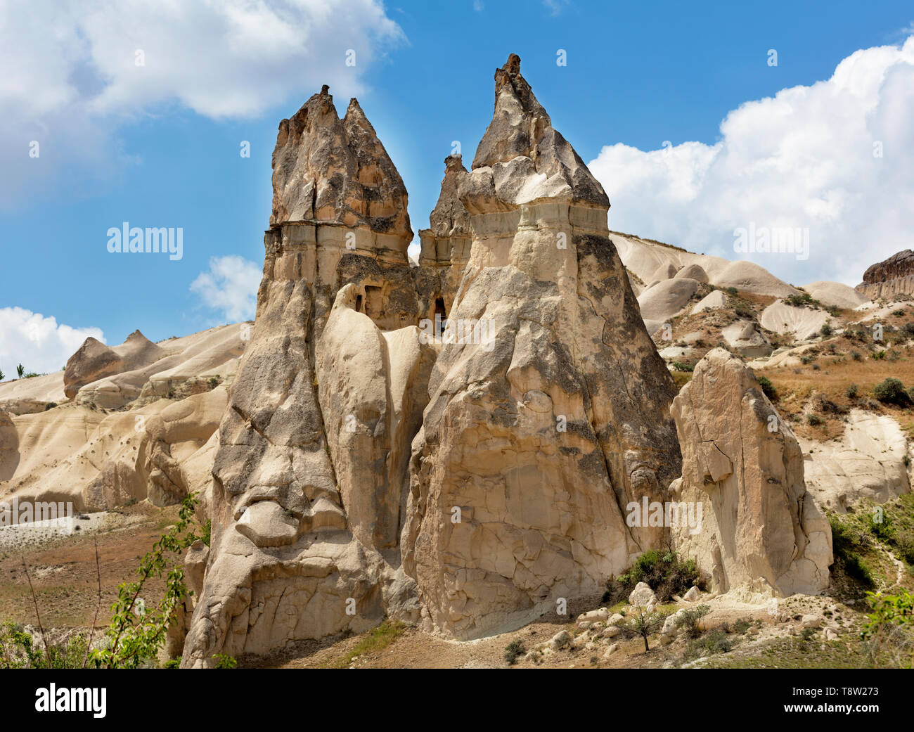 Stone conical houses in the ancient rocks of Goreme, Cappadocia. Rural ...
