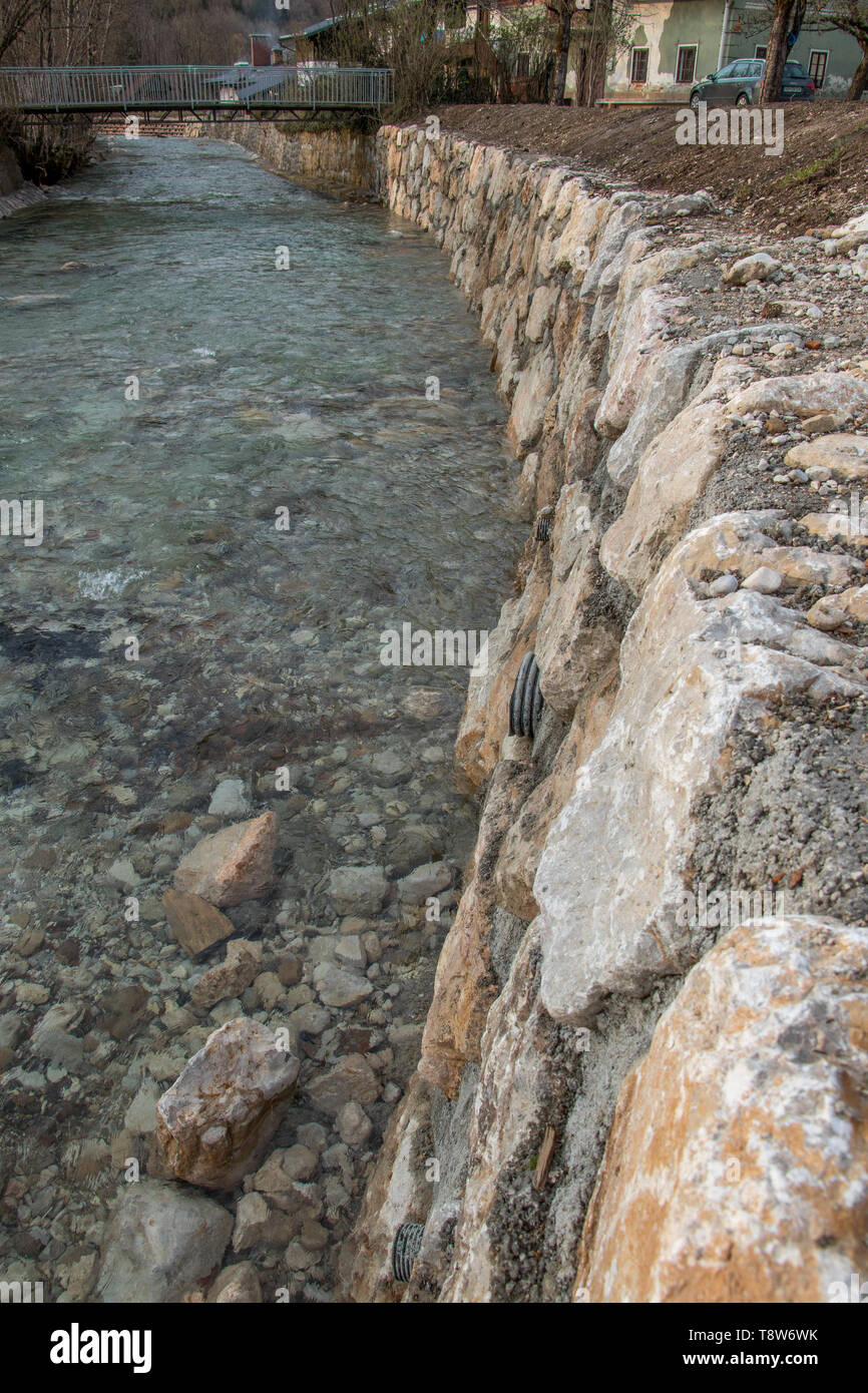 riverbank build from rocks Stock Photo - Alamy