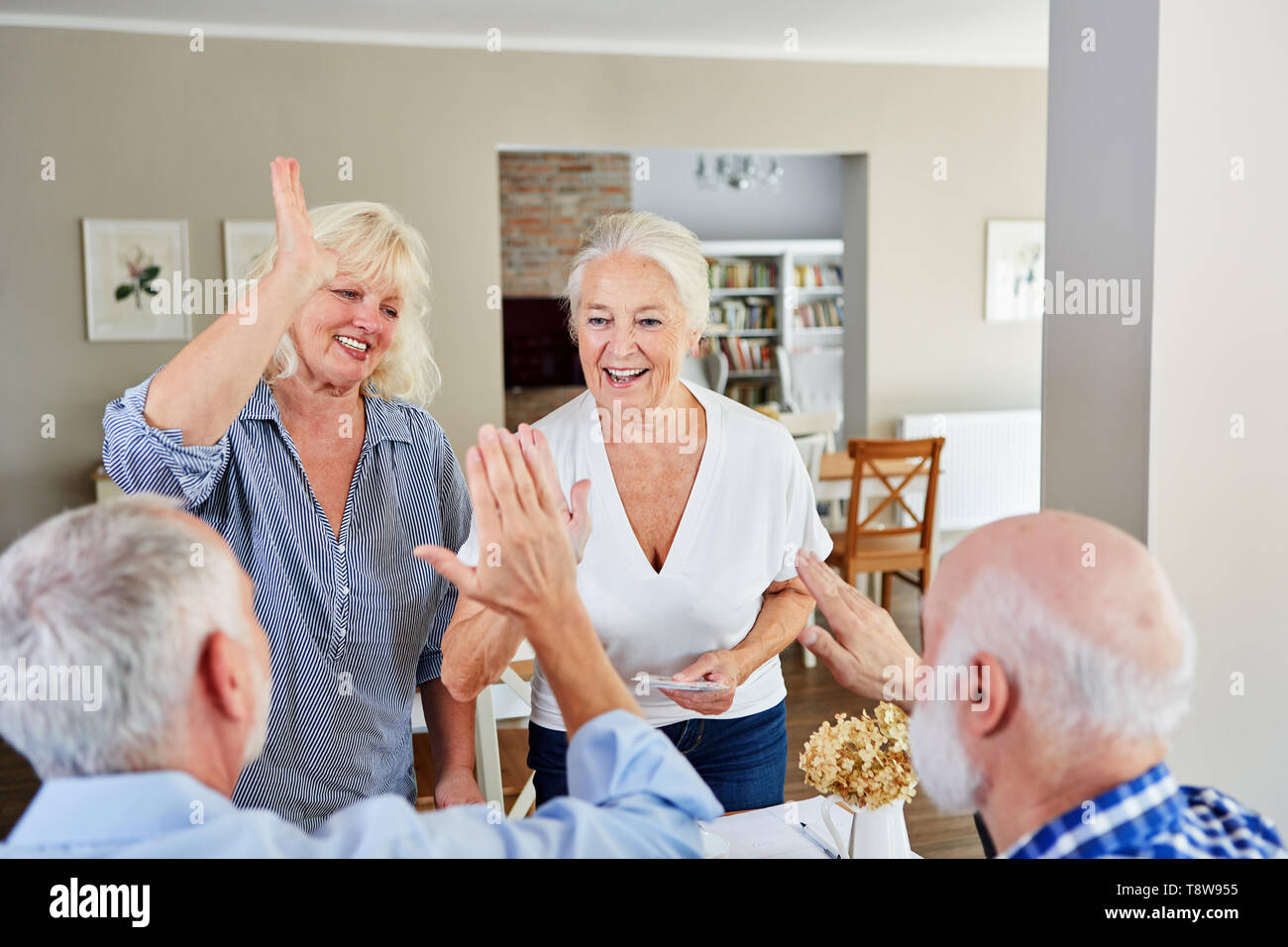 Seniors are happy to play cards and motivate themselves with the High ...