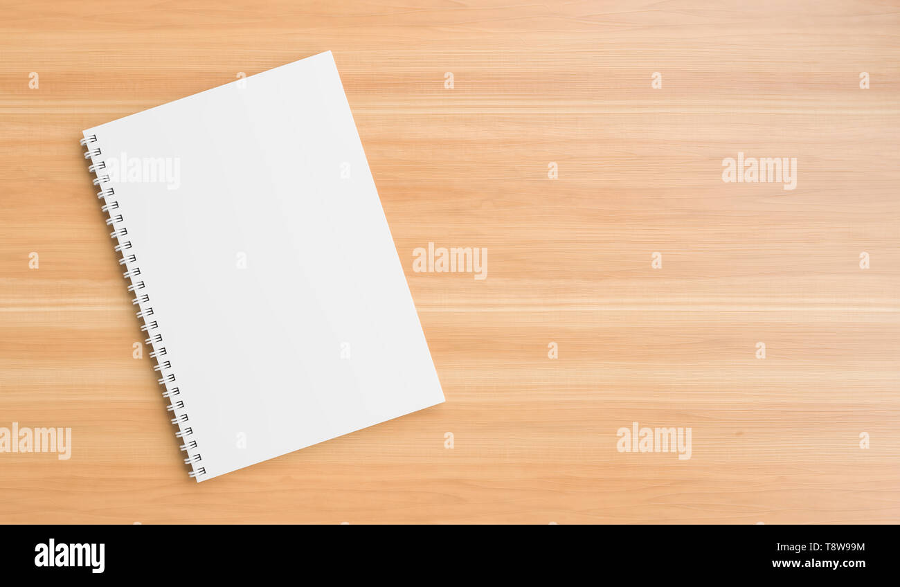 A4 format spiral binding notebook mock up on wooden table. Realistic ...