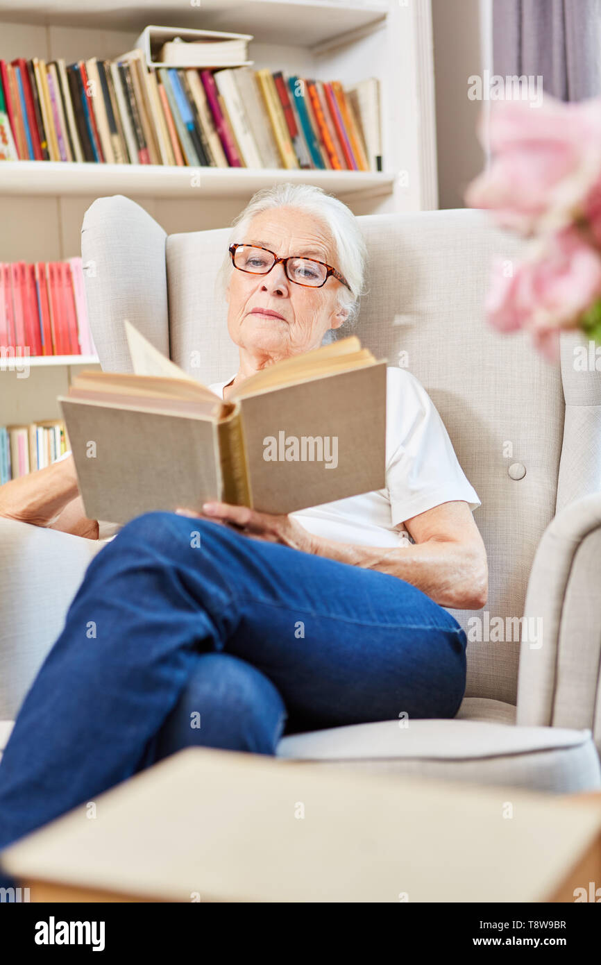 Retired senior citizen sitting in the armchair in her senior citizen ...