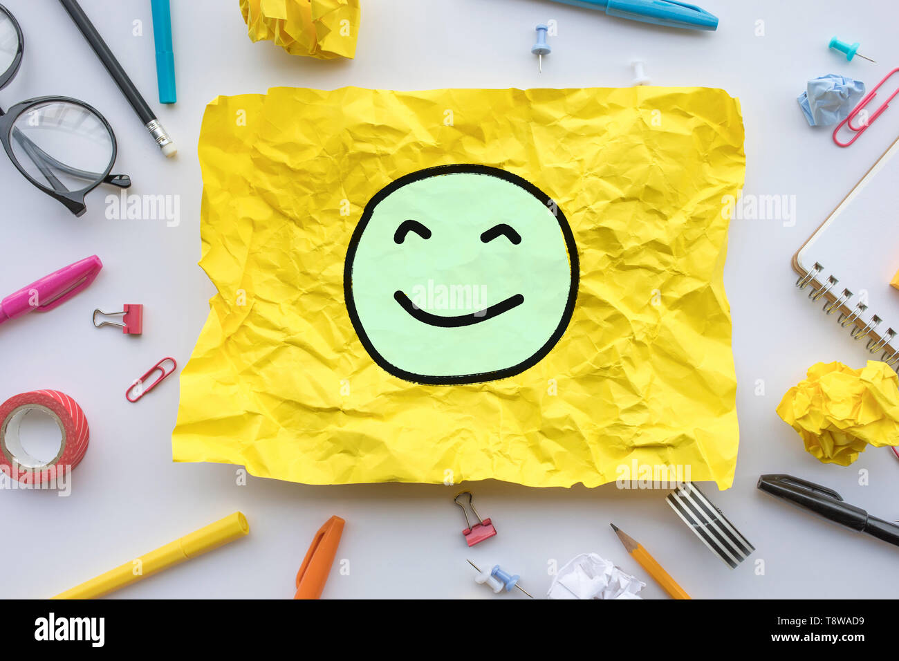 Worker emotion concepts with emoticon face on yellow paper crumpled ...