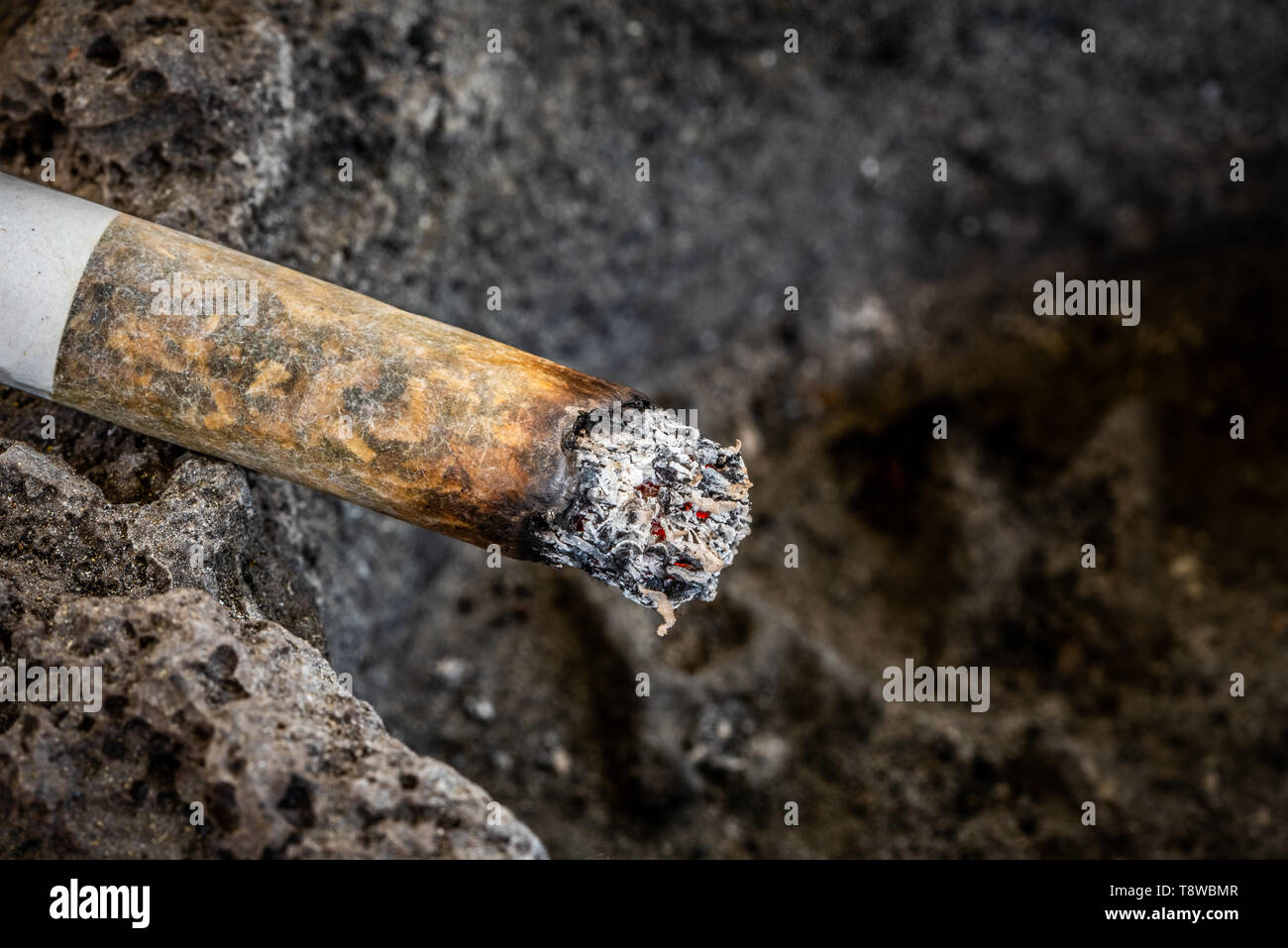 Ashtray burning cigarette on black hi-res stock photography and images ...