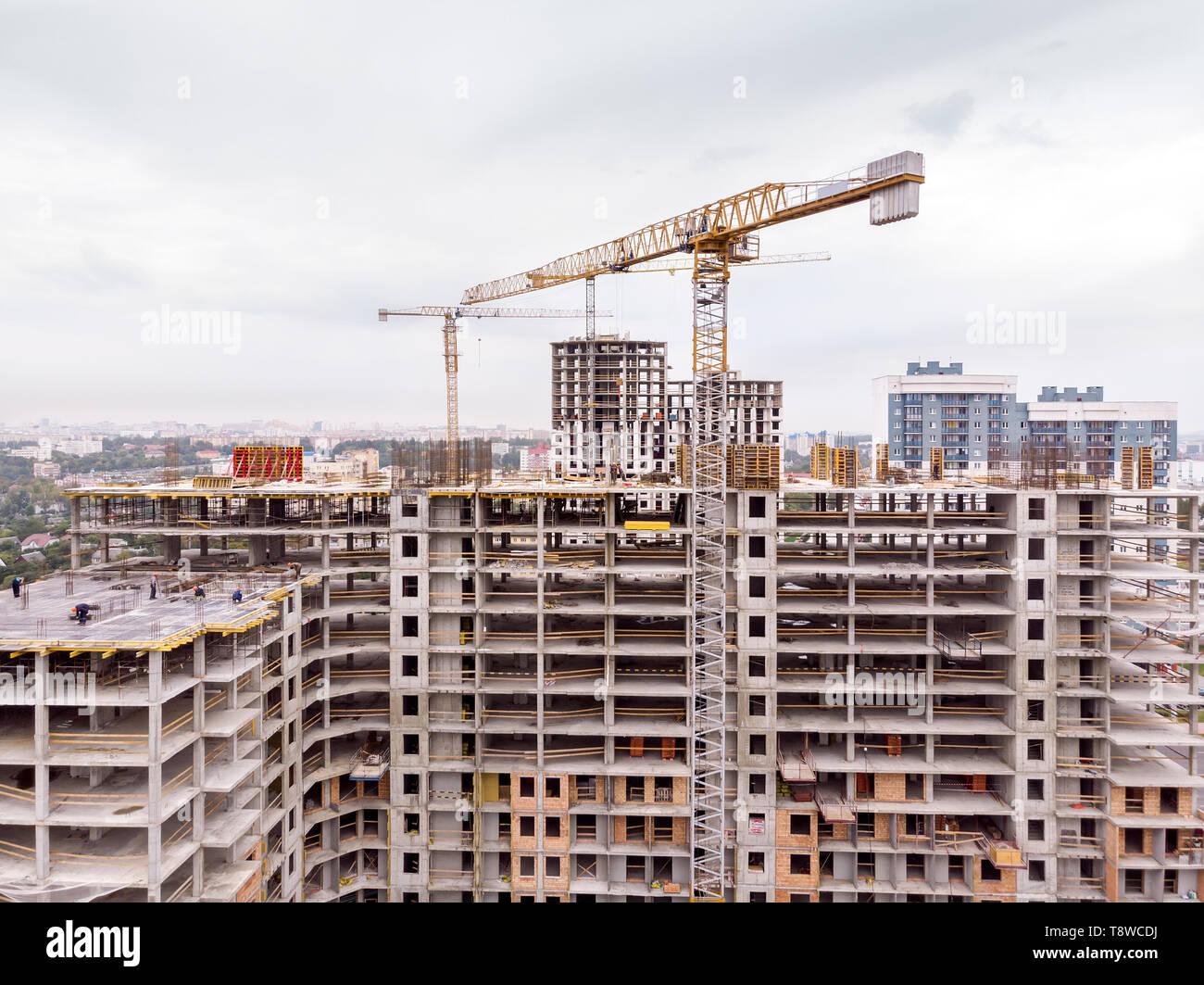new apartment buildings under construction with cranes. aerial view ...