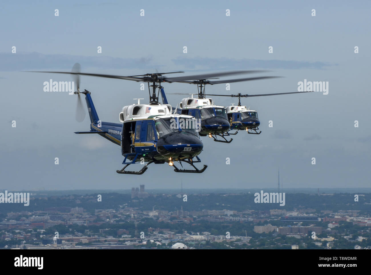 Members of the 1st Helicopter Squadron fly UH-1 Hueys over Washington ...