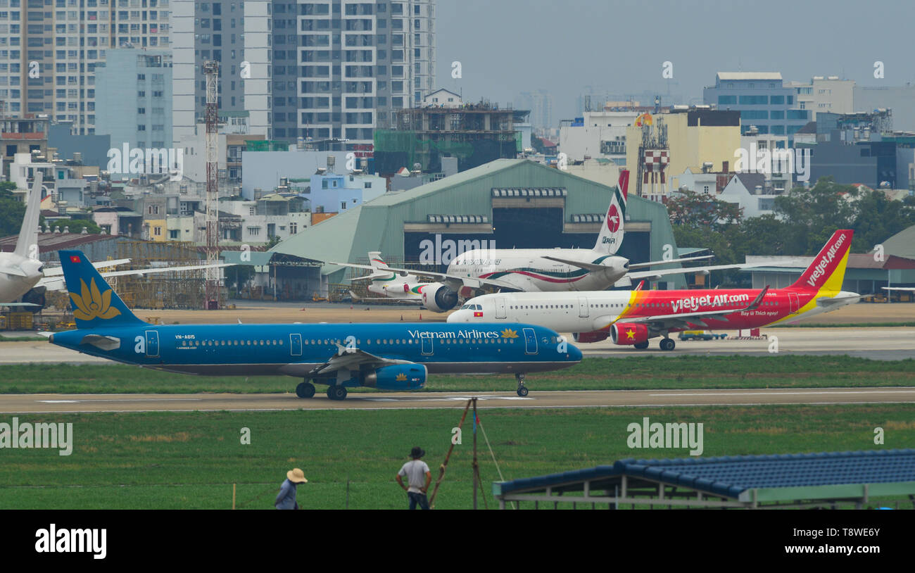 Saigon, Vietnam - May 11, 2019. Passenger airplanes taxiing on runway ...