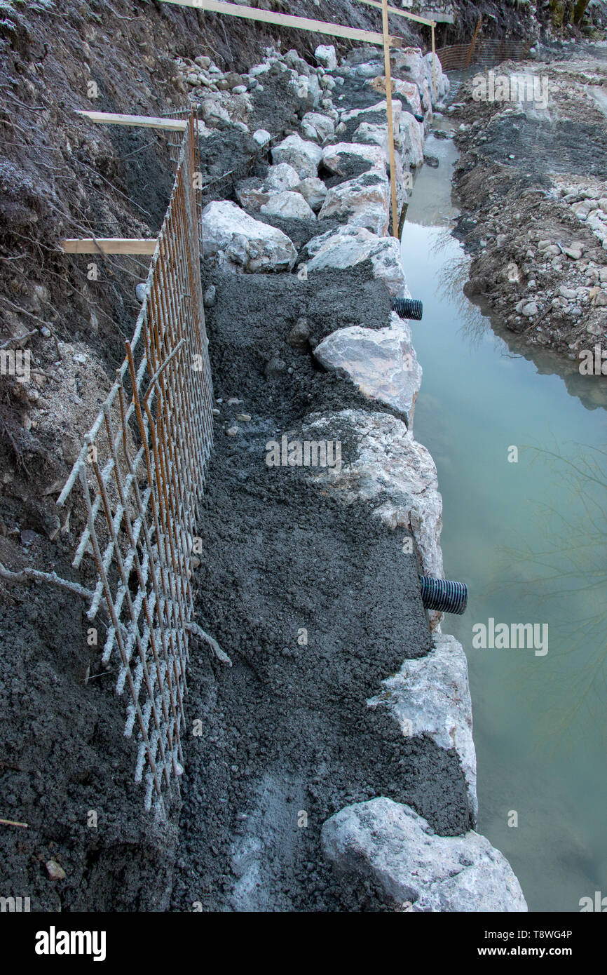 big rocks and concrete on river bank Stock Photo - Alamy