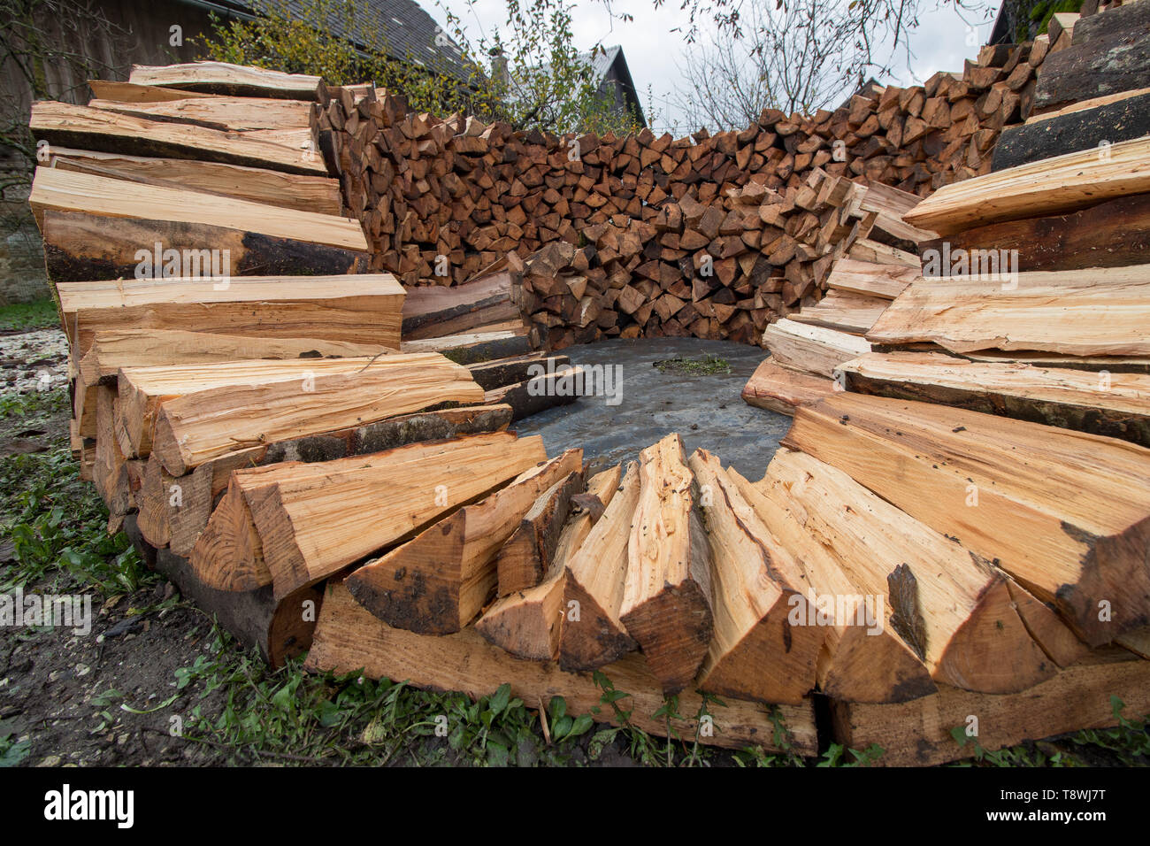 round wood pile half build Stock Photo - Alamy