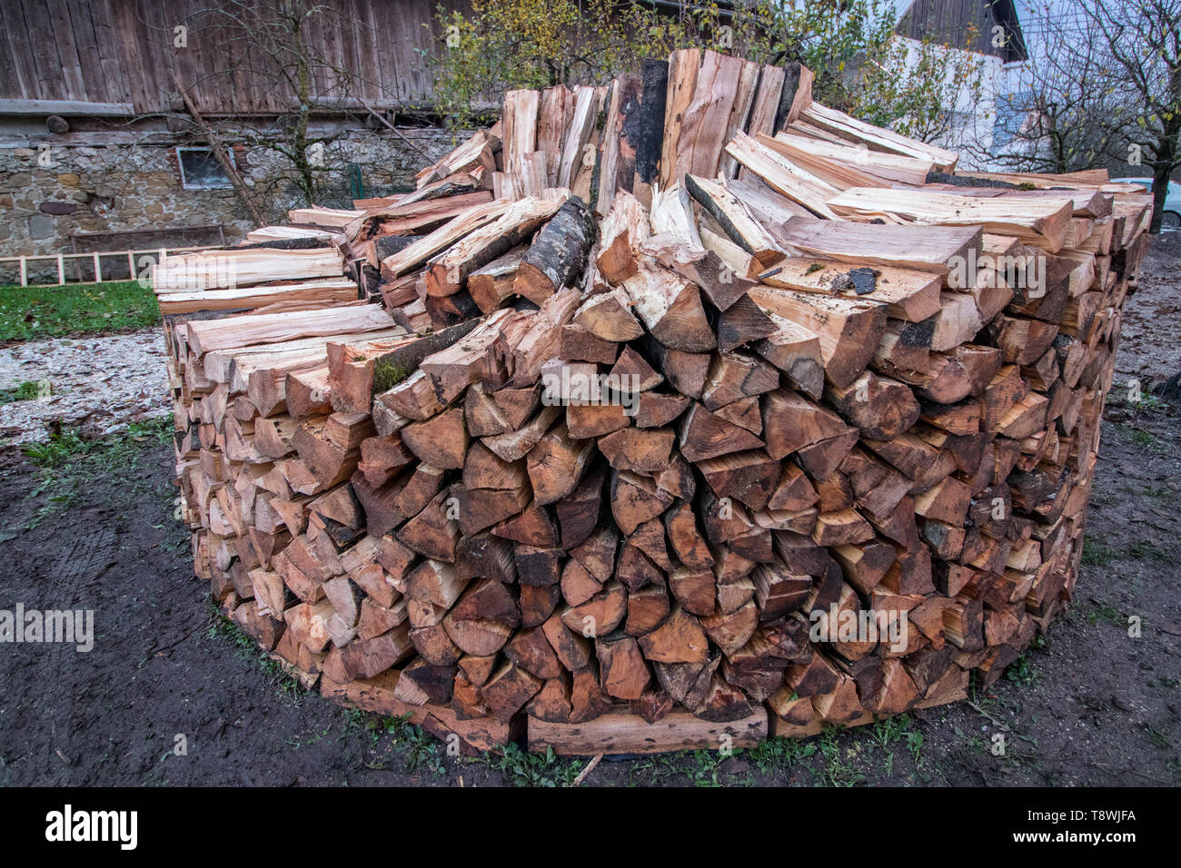 almost finished round wood pile Stock Photo - Alamy