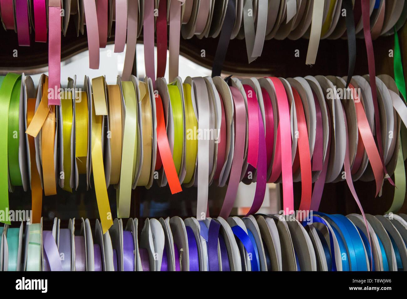 multicolored threads and ribbons. Background for the store selling ...