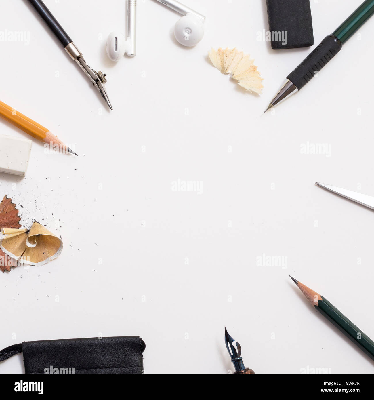 Background with white paper, pencils and eraser. Workplace for the ...