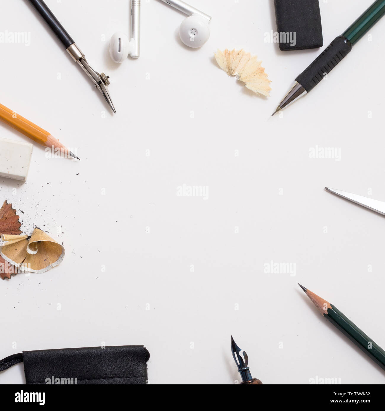 Background with white paper, pencils and eraser. Workplace for the ...