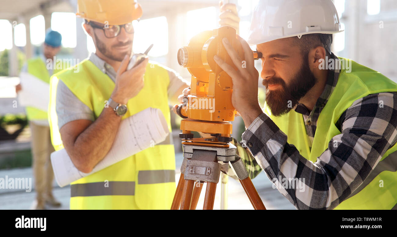 Portrait of construction engineers working on building site Stock Photo ...